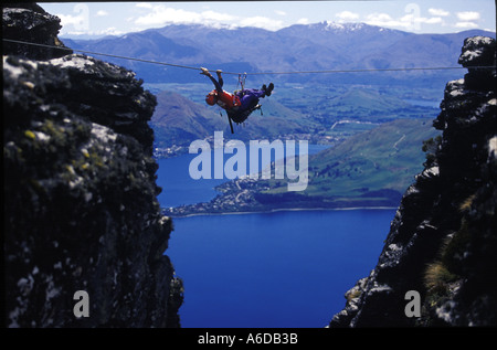Tyrolian traverse over Queenstown during adventure race Stock Photo - Alamy
