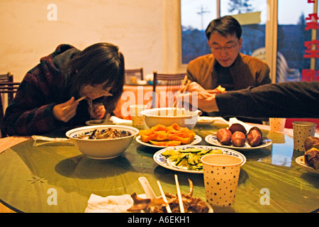 CHINA SIMATAI Chinese family eating shared dinner in rural village near ...