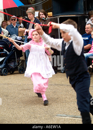 Girls maypole dancing UK. Schoolgirls dance around the maypole at ...