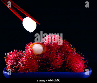 Rambutan fruit at the supermarket Stock Photo - Alamy