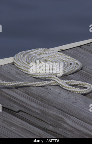 rope coiled on dock Stock Photo - Alamy