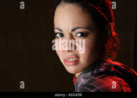 Portrait of a woman snarling Stock Photo - Alamy
