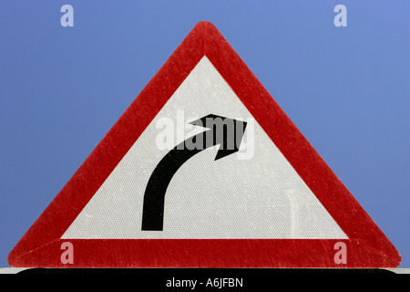 Sharp right hand bend sign on a country road in UK Stock Photo - Alamy