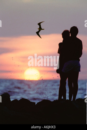 Romantic Couple Silhouette Standing on Beach at Sunset Stock Photo - Alamy