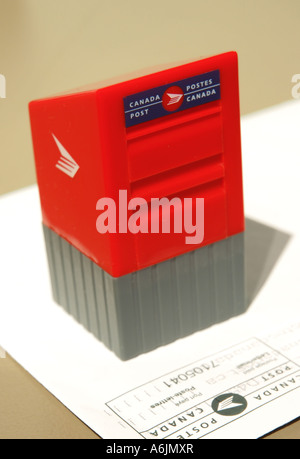 Miniature Canada Post stamp dispenser in the shape of a mailbox and 51 ...