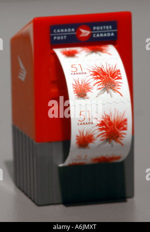 Miniature Canada Post stamp dispenser in the shape of a mailbox on top ...