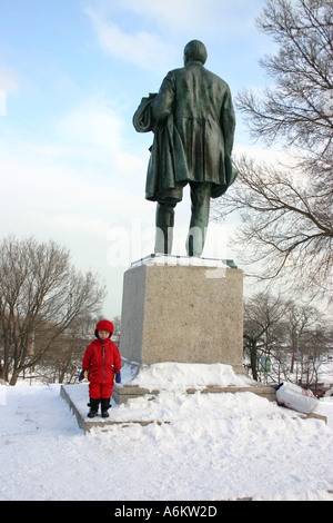 happy boy sliding on sled down snow hill in winter Stock Photo - Alamy