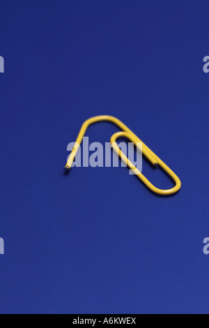 A single bent metal paper clip isolated on a white background Stock ...