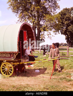Romany gypsy woman traditional horse drawn wooden caravan wagon at ...
