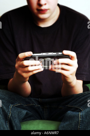 children playing play station portable psp game on an airplane Stock ...