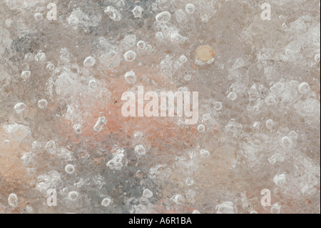 Abstract pattern of ice over pebbles Stock Photo - Alamy