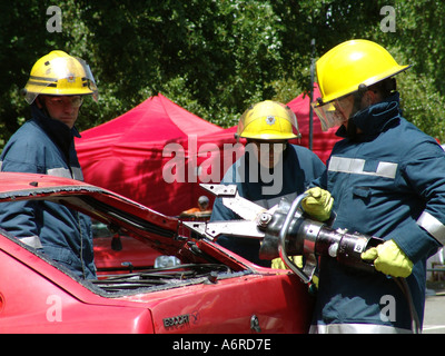 Emergency services cutting the roof off a car involved in an Stock ...