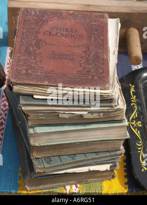Front view of old books stacked on a shelf. Books without title and ...