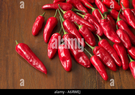 Chillies on a table variety Apache F1 hybrid Stock Photo - Alamy