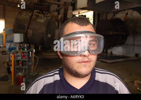 Factory worker wearing high impact safety goggles glasses Stock Photo ...