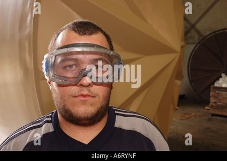 Factory worker wearing high impact safety goggles glasses Stock Photo ...