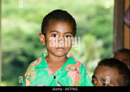 A fijian boy in Navala Village, Fiji, at the entrance to the chiefs ...