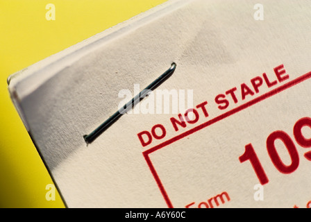 A stapled a business tax form that says Do Not Staple Stock Photo - Alamy