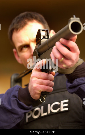 A UK POLICEMAN WITH A BATON GUN Stock Photo - Alamy