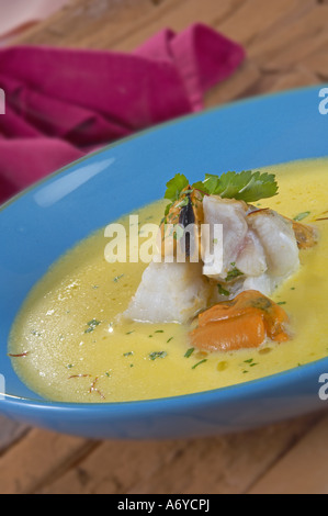 Mussel and monkfish soup with saffron Stock Photo - Alamy