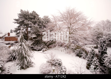 Snow covered suburban back garden in the UK Stock Photo - Alamy