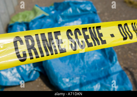 yellow police tape cordoning off a crime scene Stock Photo - Alamy