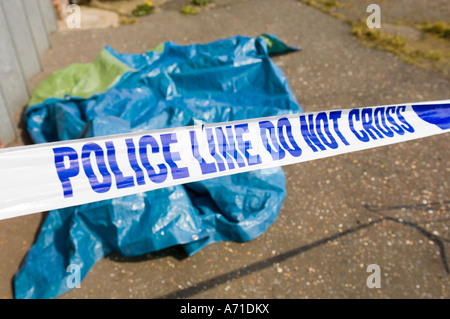 blue and white police tape cordoning off a crime scene Stock Photo - Alamy