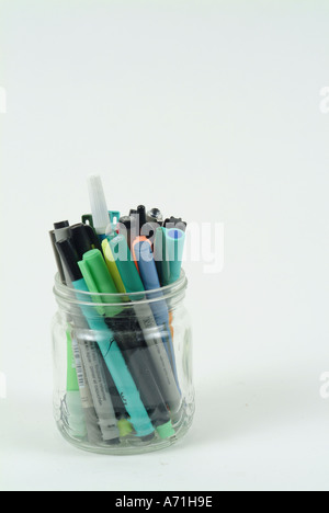 Collection of pens and markers in a clear glass jar Stock Photo - Alamy