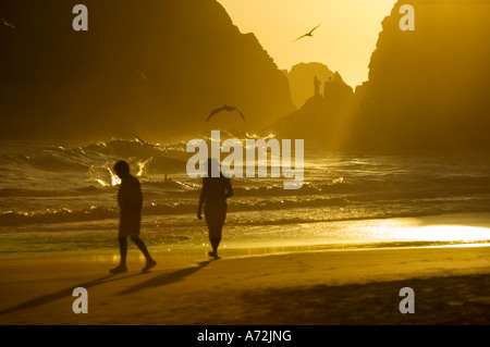Zipolite - men walks on the sand at sunset - Oaxaca - Mexico Stock ...