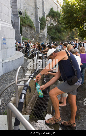 LOURDES FRANCE Drinking Lourdes water from a tap. Almost a million come ...