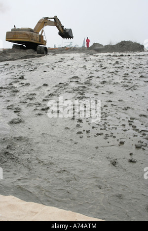 Pouring sand suck from the sea onto the beach in Malaysia Stock Photo ...