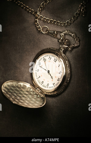 Four old-fashioned pocket watches over white background Stock Photo - Alamy