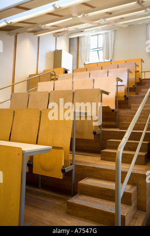Empty folding wooden university auditorium seats in an empty classroom ...