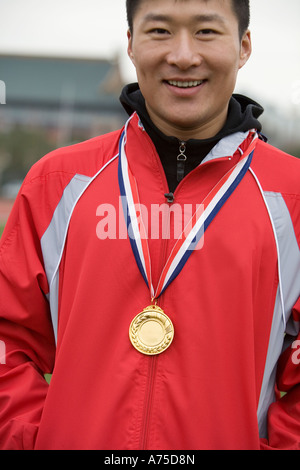 Asian Chinese Man with Gold Medal and Trophy in isolated White ...