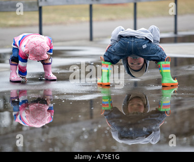 Toddler looking through legs Stock Photo - Alamy