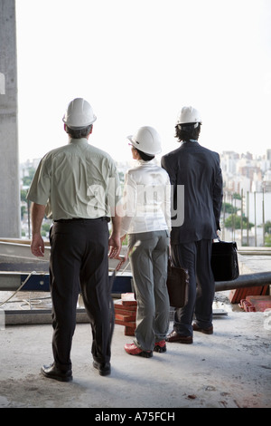 Businesspeople standing in construction area Stock Photo - Alamy