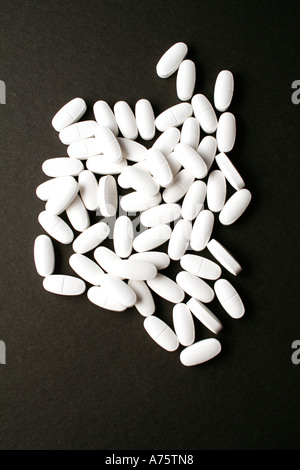Close up of assorted multicoloured capsules and white pills Stock Photo ...