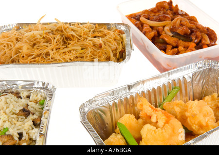 Chinese takeaway containers of freshly prepared food on a pure white ...