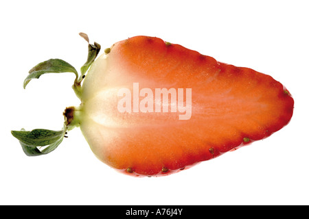 Close up of one cut strawberry on a pile of fresh ripe strawberries ...