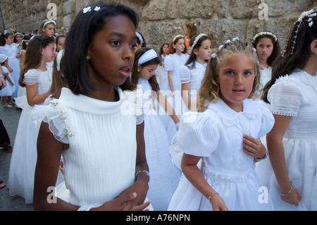Girls wearing their communion dresses in Corpus Christi procession ...