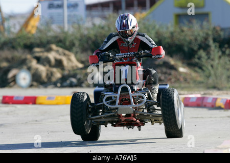 quad racer wheelies his bike at the Motorcycle and Karting show ...