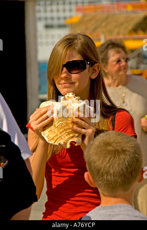 Island woman blowing conch shell, Cook Islands, Atiu Stock Photo - Alamy