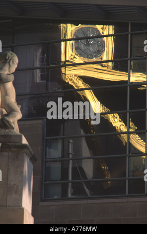 The reflection of a grand clock on window glass. Antwerp, Belgium Stock ...