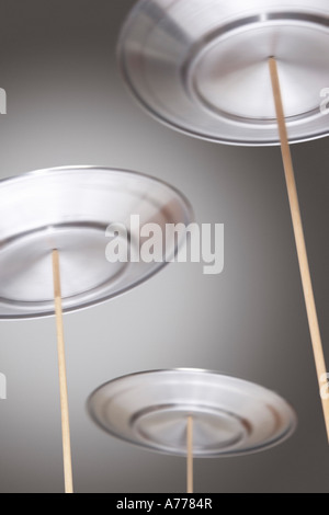 Plates Spinning on Sticks Stock Photo - Alamy