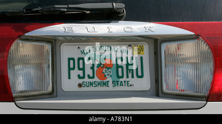 License plate orange white rectangle rectangular blue yellow red curve ...