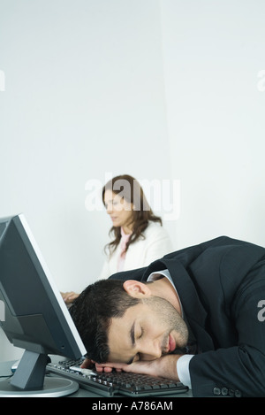 Tiredness businessman sleeping in suit with bag and mobile on hand ...