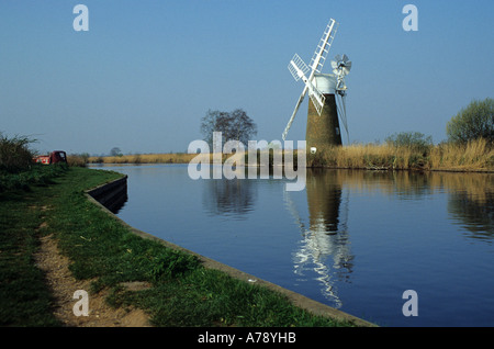 Turf Fen windmill reflected in the River Ant at sunrise, Norfolk Broads ...