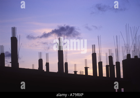 Sunset behind a Construction site silhouette building with cranes Stock ...