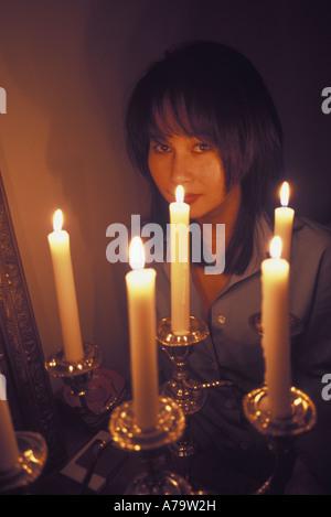 Woman Staring at Candlelight Stock Photo - Alamy