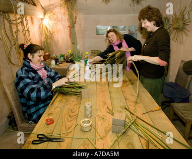 Anna Lewington teaching people to make items with rushes harvested in a ...